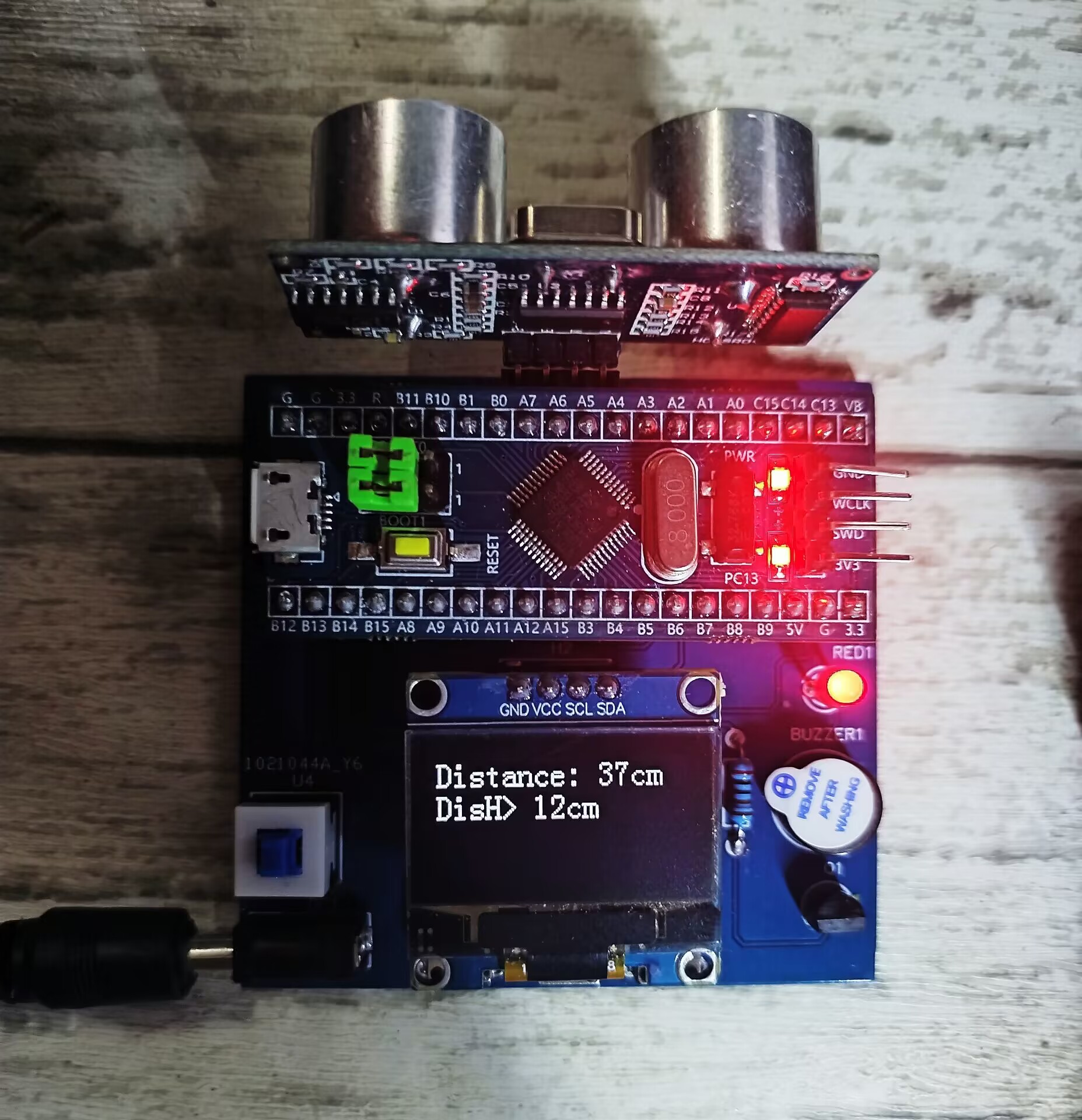 基于STM32的倒车雷达系统设计_stm32_薄情书生-GitCode 开源社区